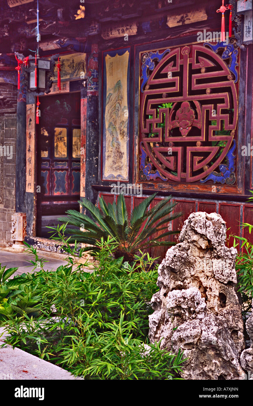 Asia, China, Yunnan Province, Jianshui. Taihu rock by ancestral hall ...