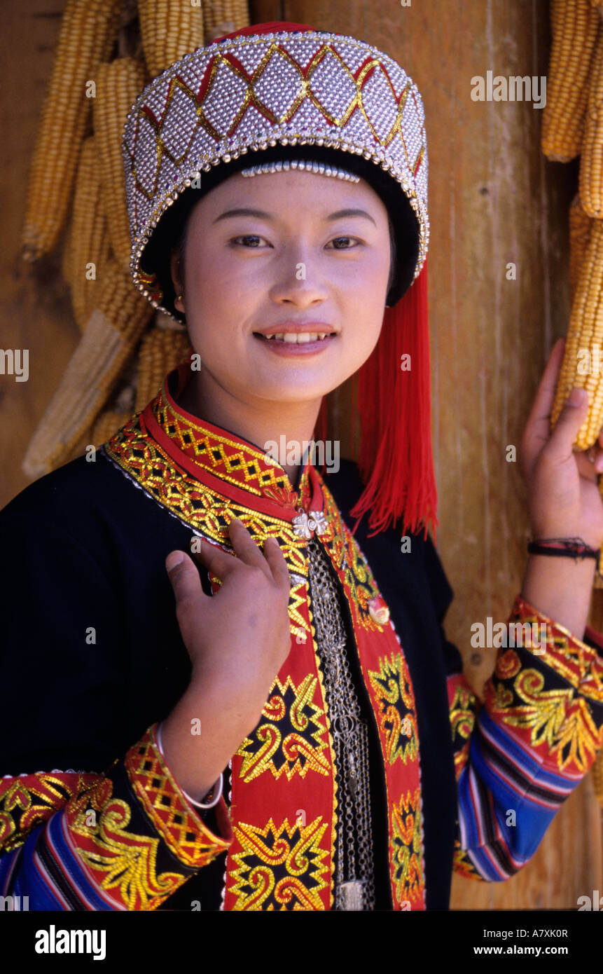 Asia, China, Yunnan Province. Young Hani minority woman in traditional ...