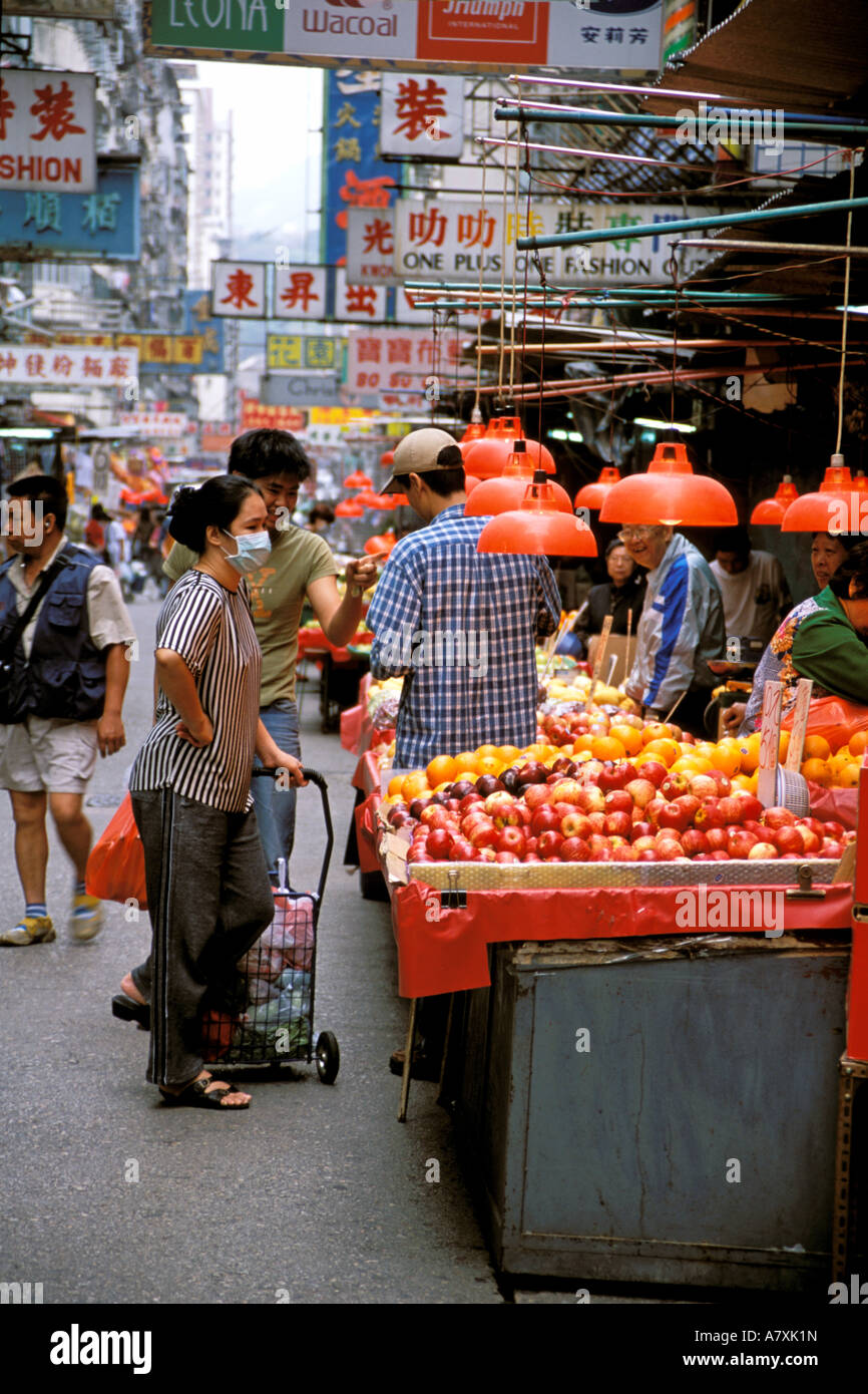Asia, China, Hong Kong. Local street market, fresh fruit vendors ...