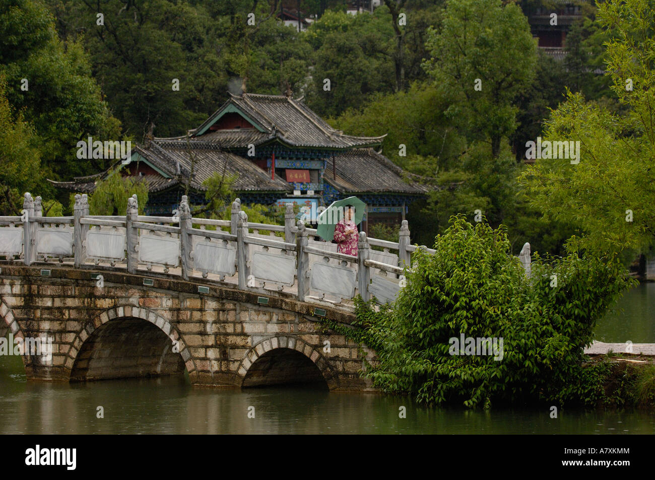Black Dragon Pool with Five-Arch bridge or Jade Belt Bridge. Lijiang ...
