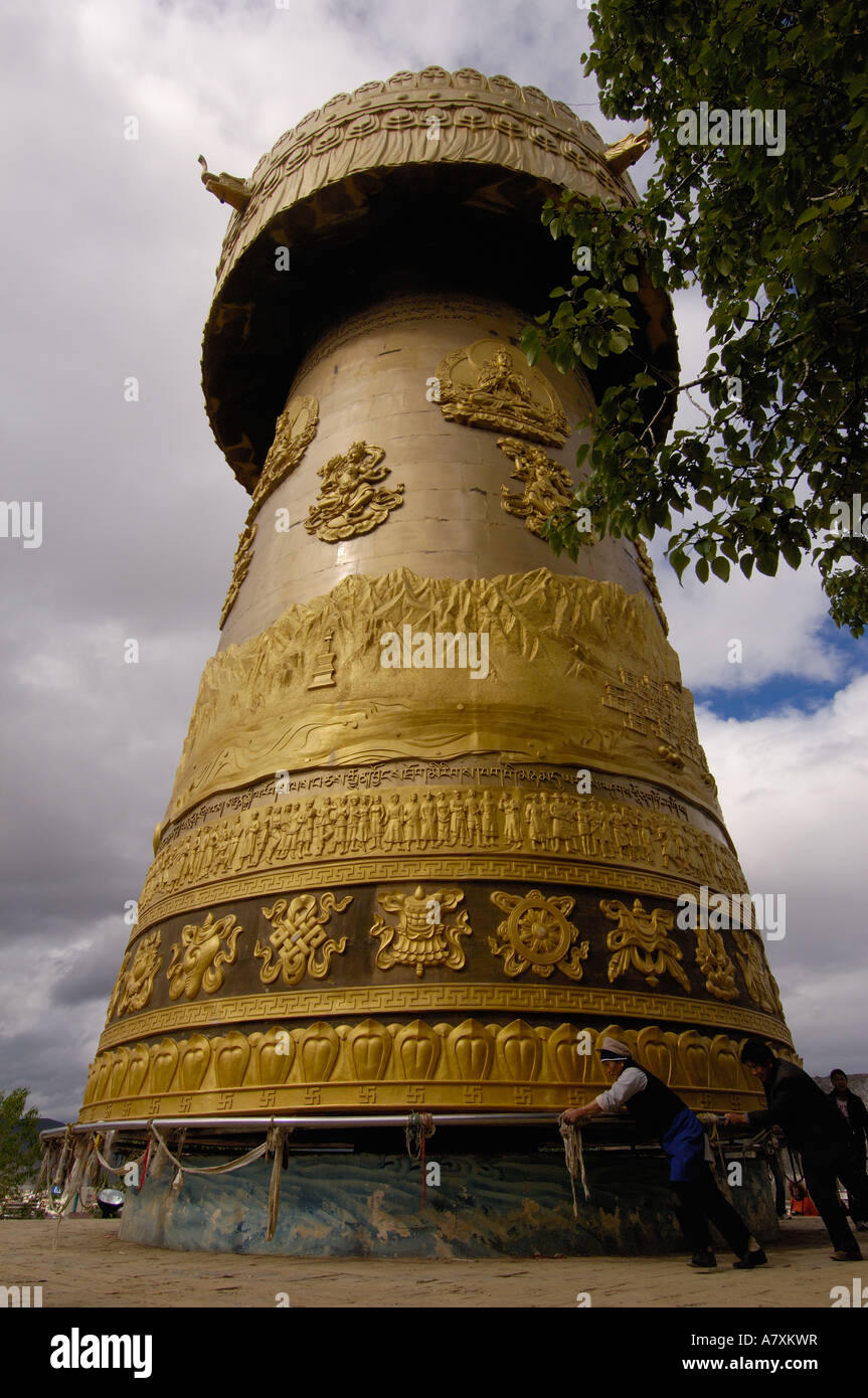 Largest Prayer Wheel in the world being turned by a Naxi woman ...
