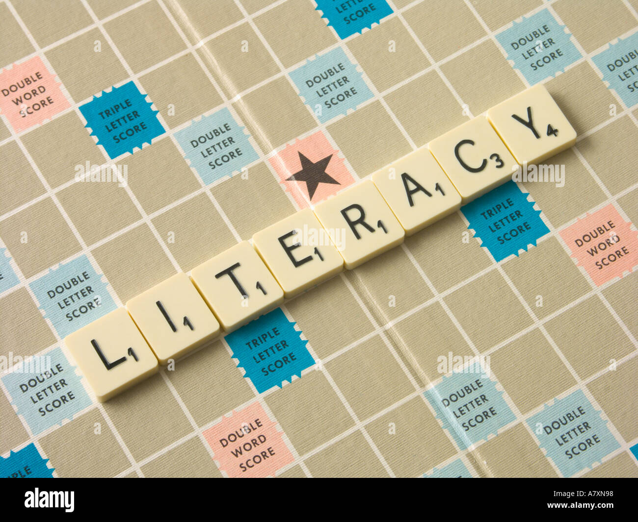 Scrabble tiles spelling the word "Literacy Stock Photo - Alamy