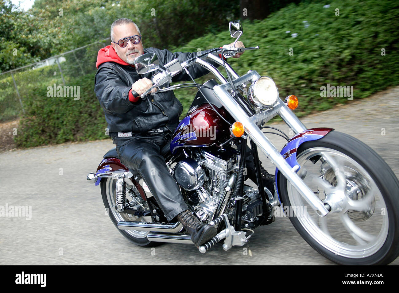 MAN RIDING MOTORCYCLE Stock Photo - Alamy