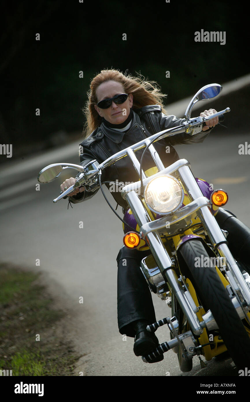 WOMAN RIDING MOTORCYCLE Stock Photo - Alamy
