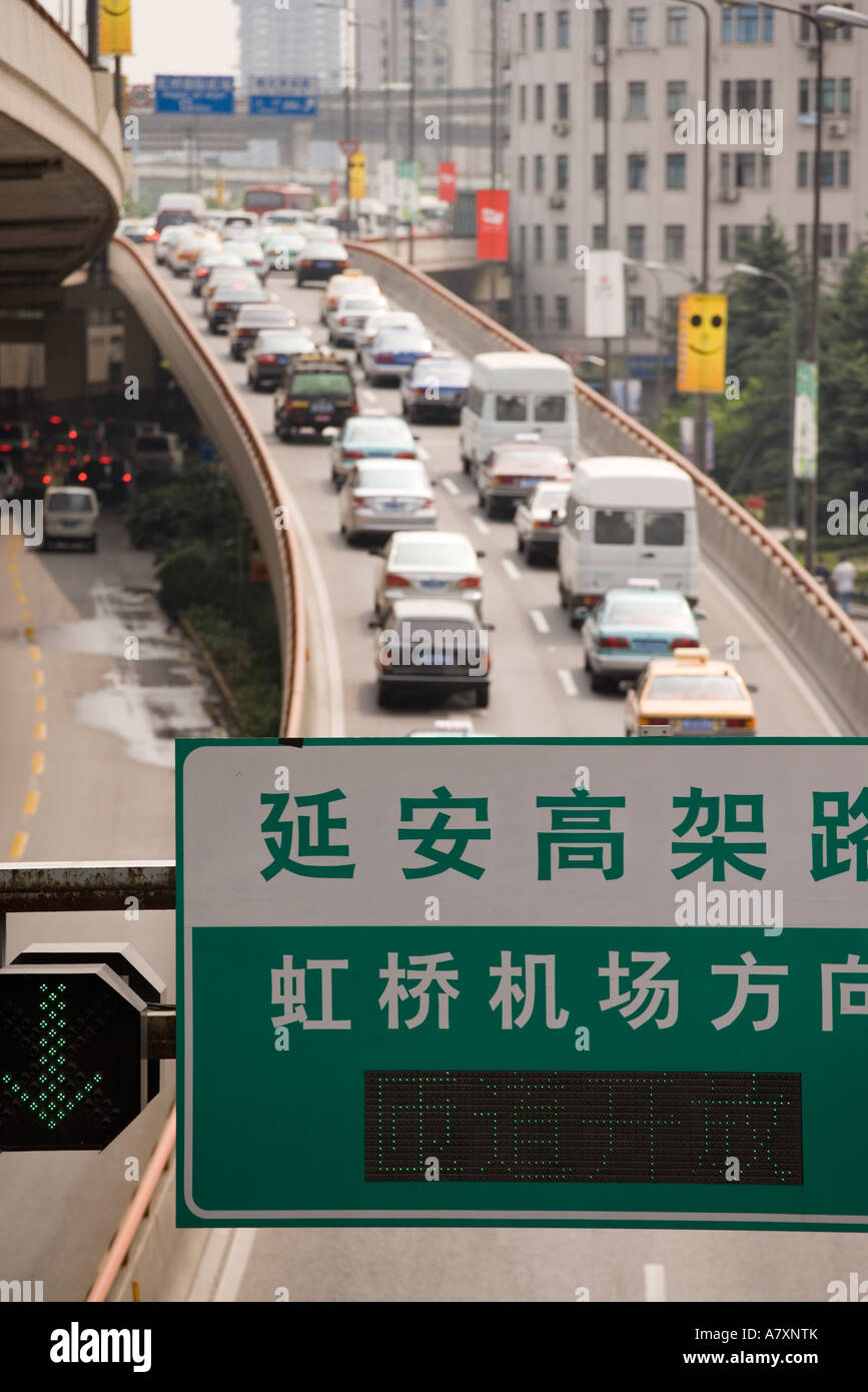 Asia, China, Shanghai, Traffic fills downtown streets near Yan'An ...