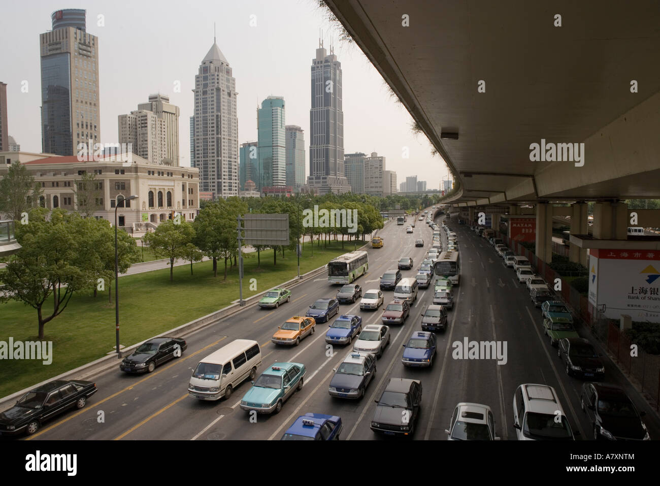 Asia, China, Shanghai, Traffic fills downtown streets near Yan'An ...