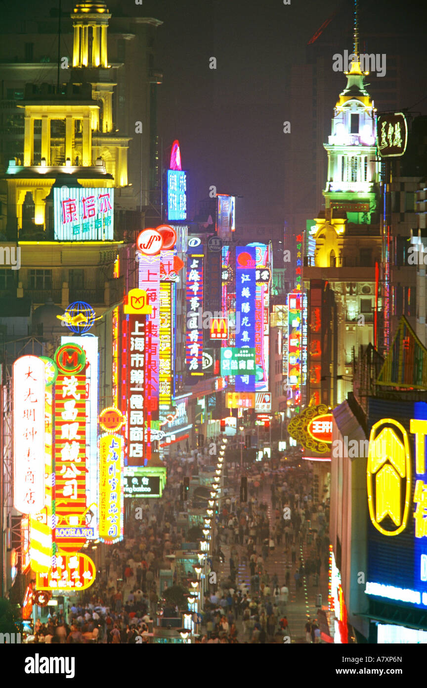 Asia, China, Shanghai. Lit buildings and neon signs along Nanjing Dong ...