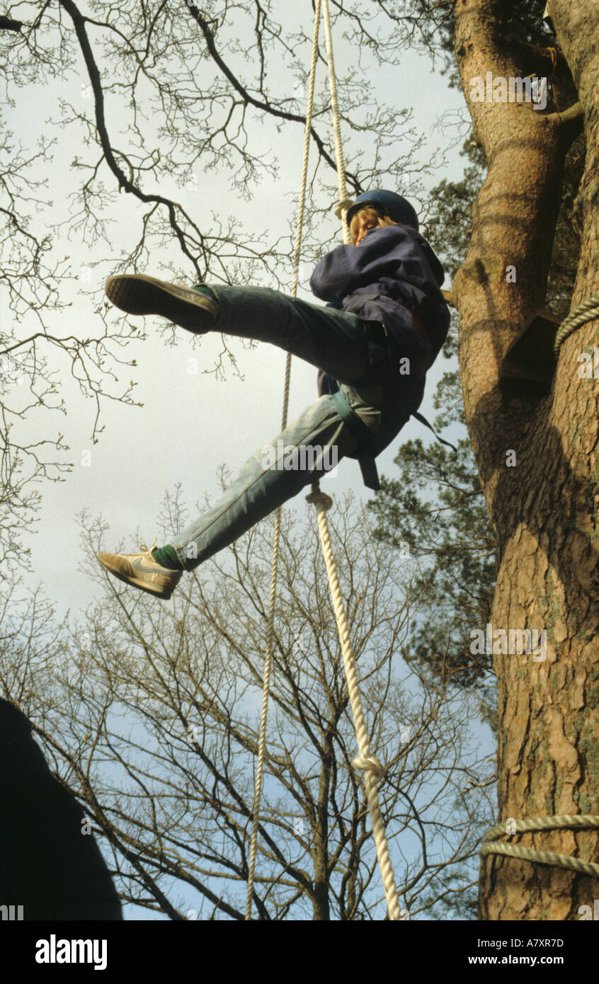 Girl dangling on rope Stock Photo - Alamy