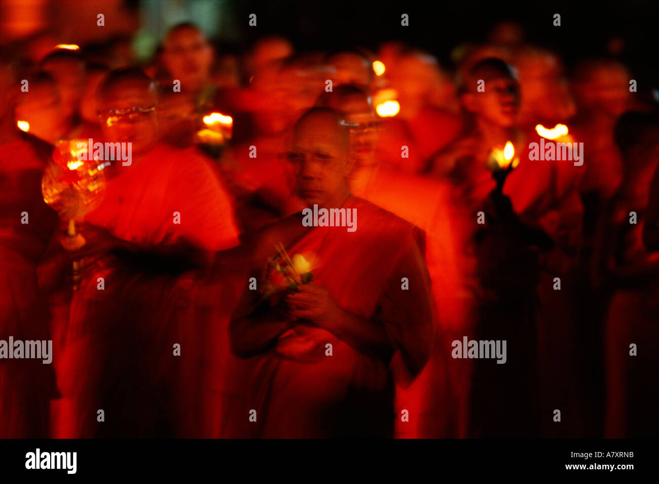 Buddhist monks circle temple three times during full moon festival ...