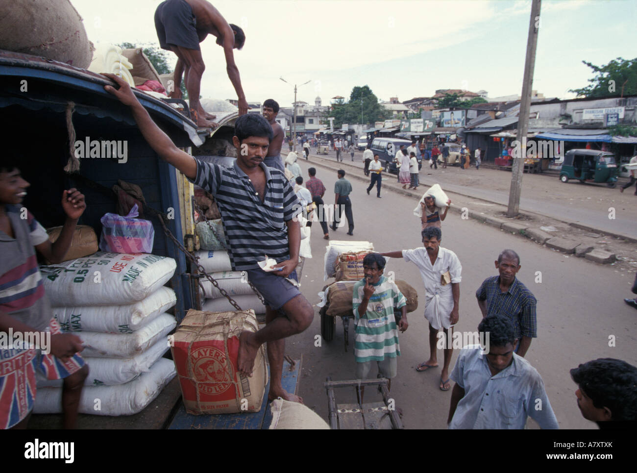 Sri Lanka, Colombo, Men work carrying bag and goods at Petah Market ...