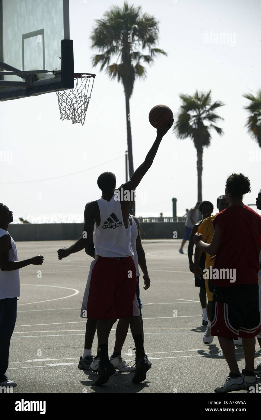Multi ethnic friends playing basketball hi-res stock photography and ...
