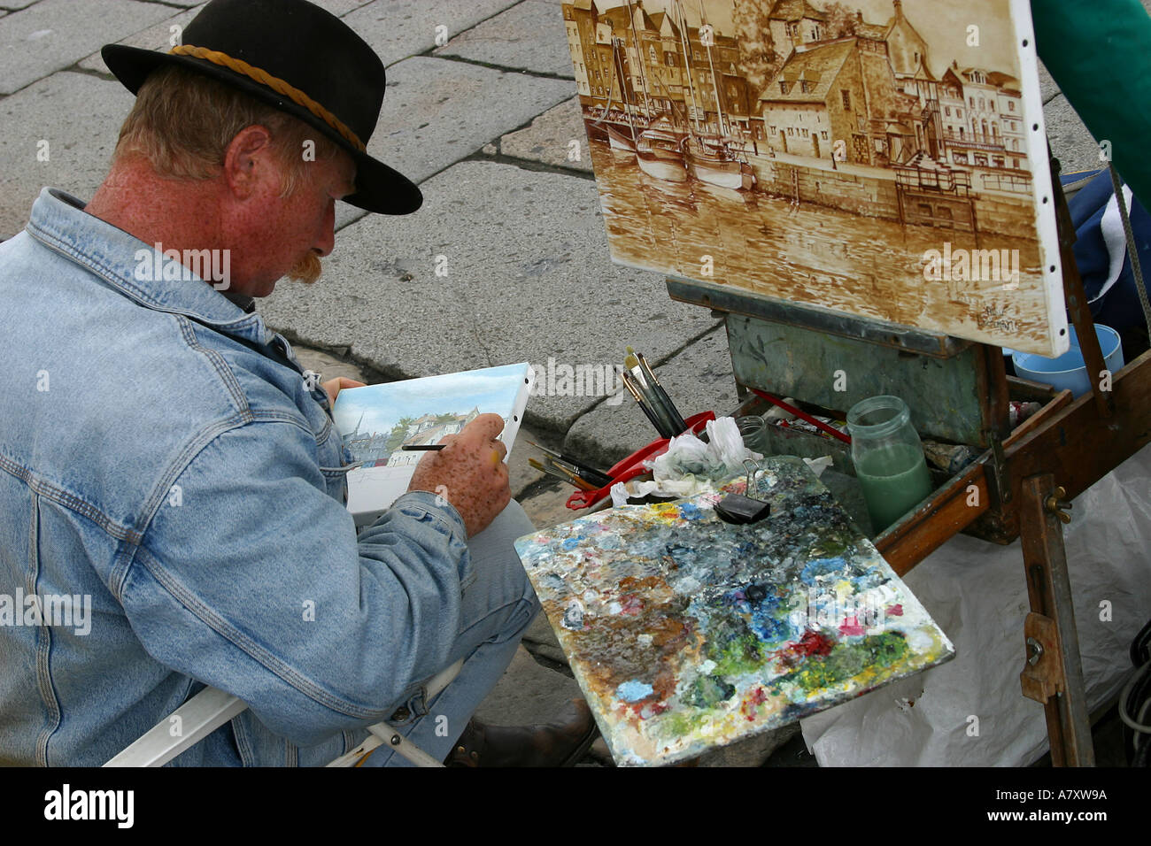 Back view male artist sitting hi-res stock photography and images - Alamy