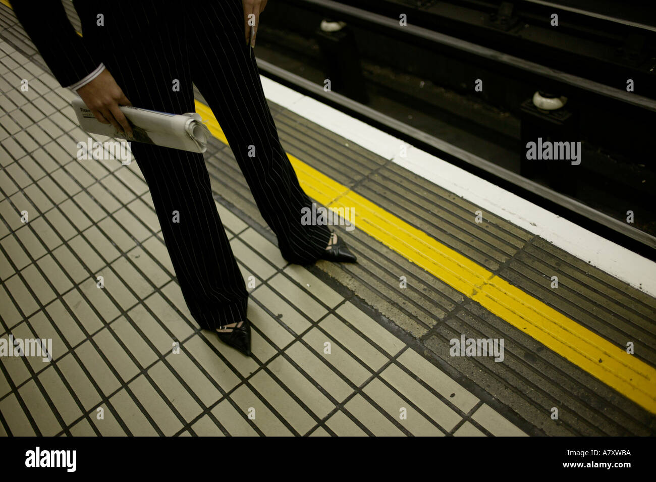 Legs on station platform Stock Photo - Alamy