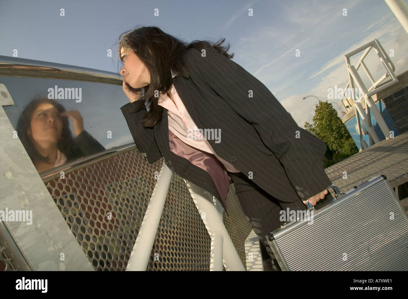 Smiling businesswoman standing outside hi-res stock photography and ...