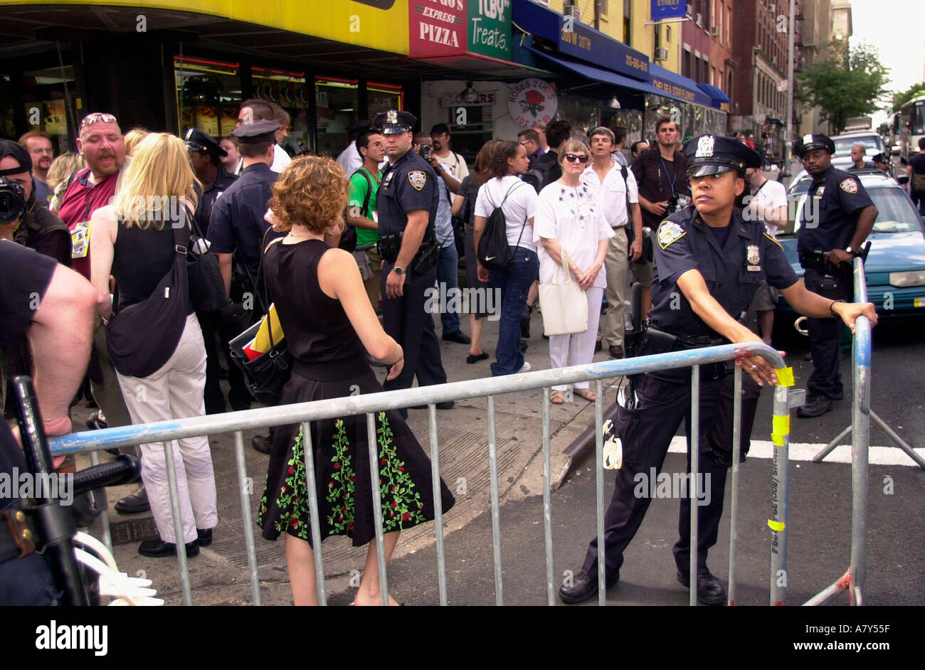NYPD officers adjust barriers for crowd control Stock Photo - Alamy