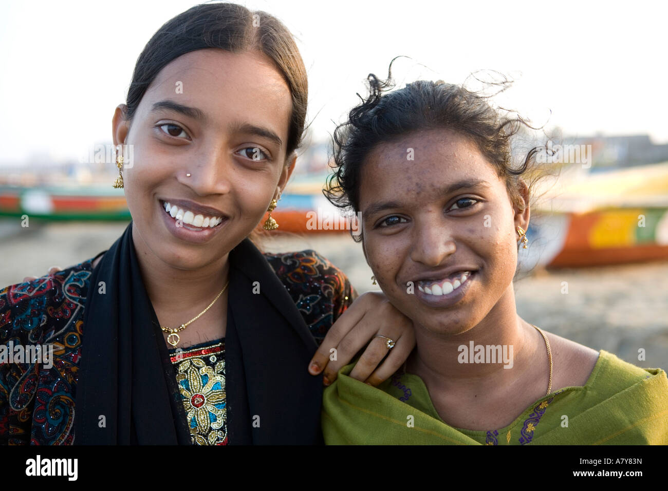 Two local women greet visitors on beach Stock Photo - Alamy
