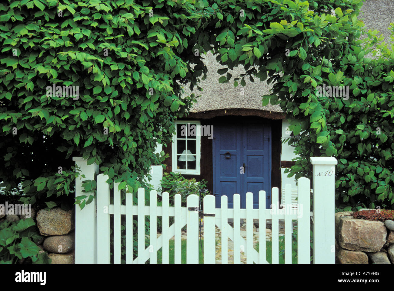 Sweden, Skane, Arild. Gate and doorway to traditional fishemans house ...