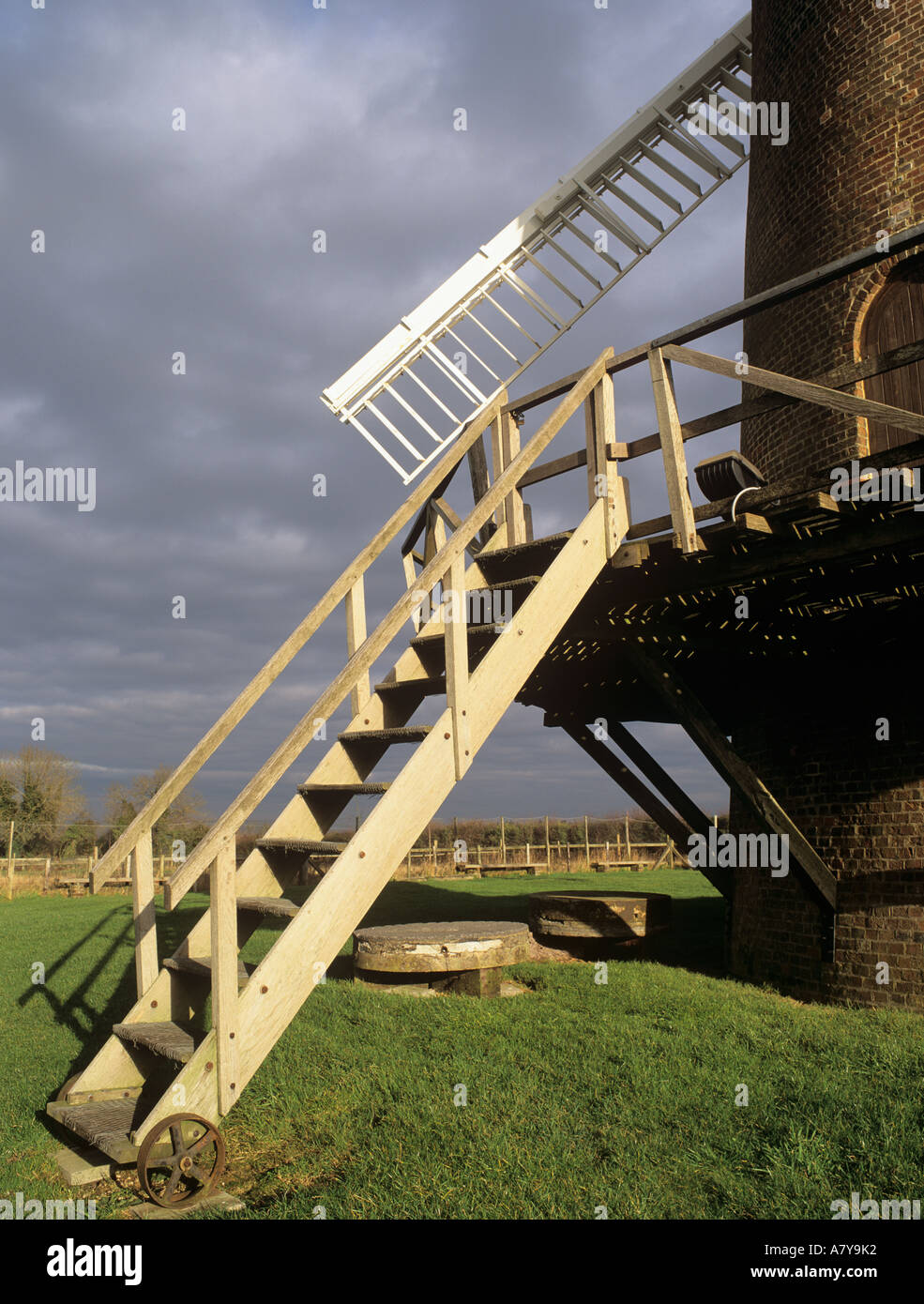 WOODEN STEPS to platform on Wilton Windmill in sun against grey ...
