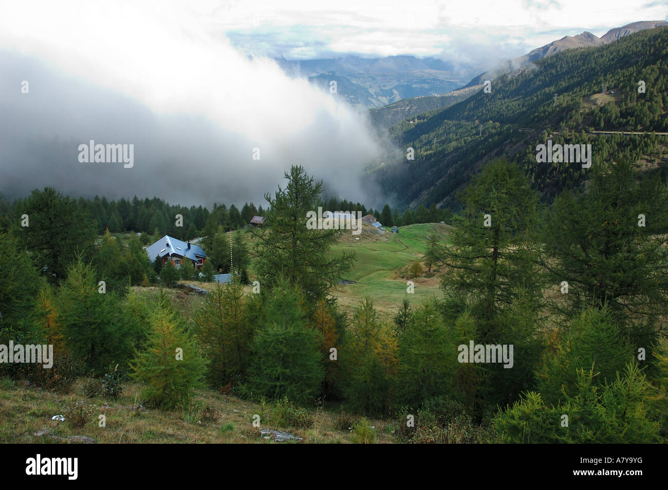 Italy, Simplon Pass, low clouds entering valley Stock Photo - Alamy
