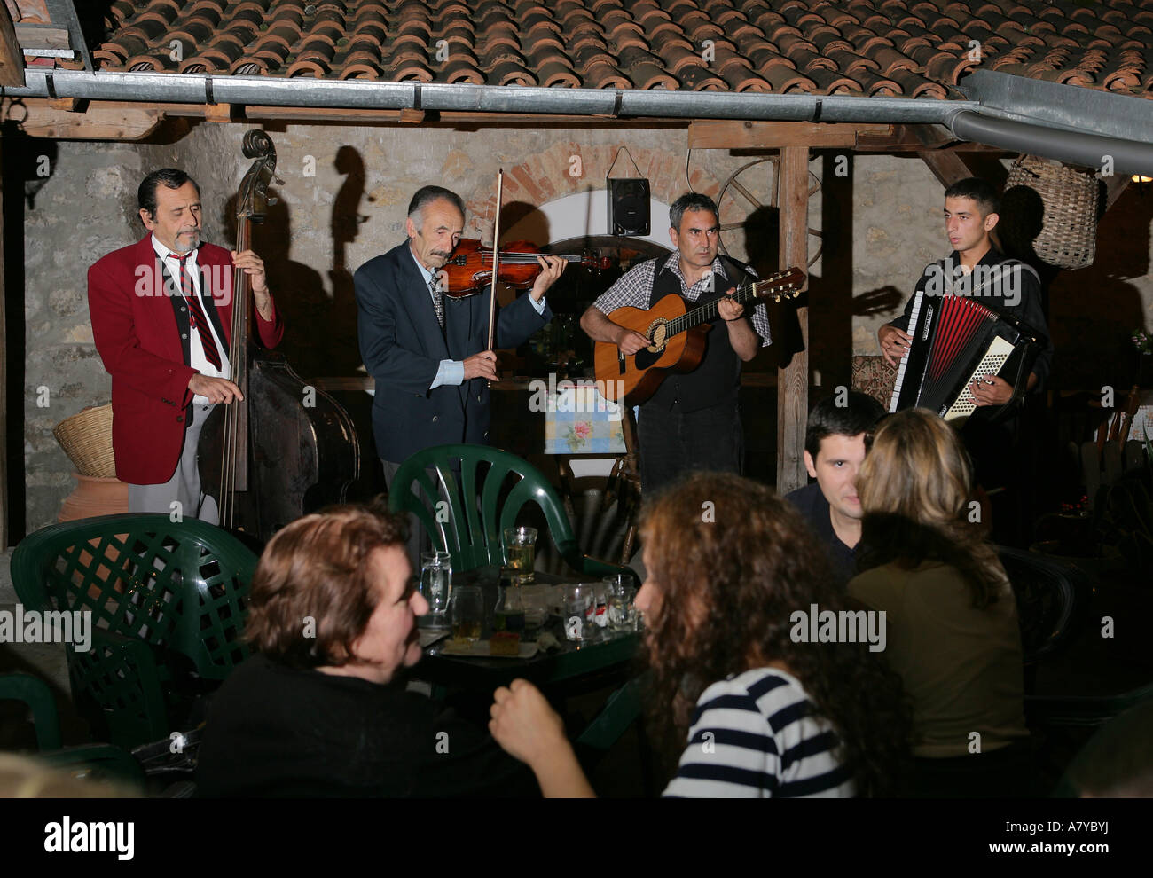 Gypsy musicians play at a restaurant in Valjevo, Serbia Stock Photo - Alamy