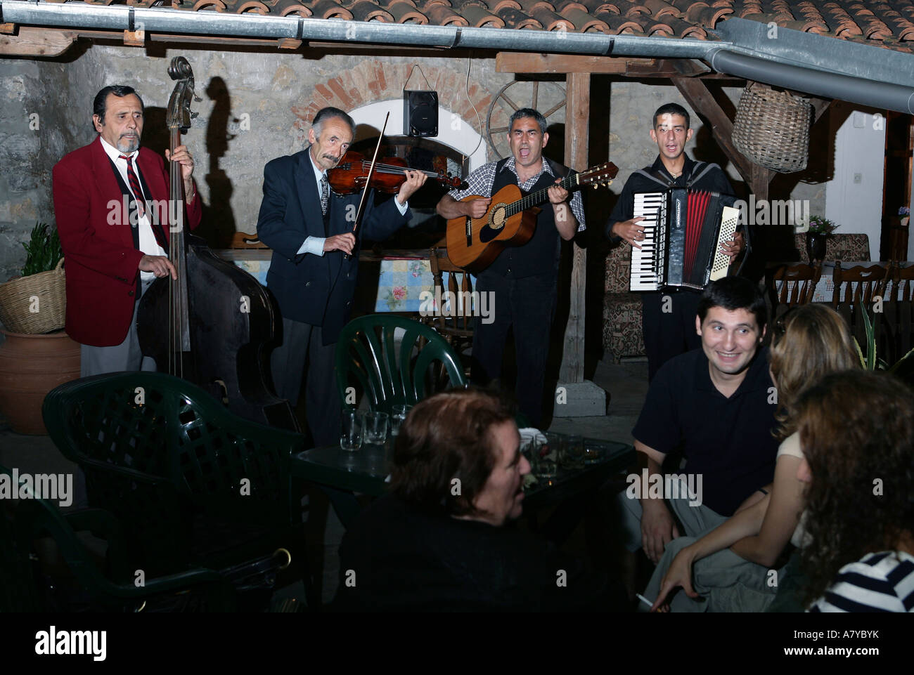 Gypsy musicians play at a restaurant in Valjevo, Serbia Stock Photo - Alamy