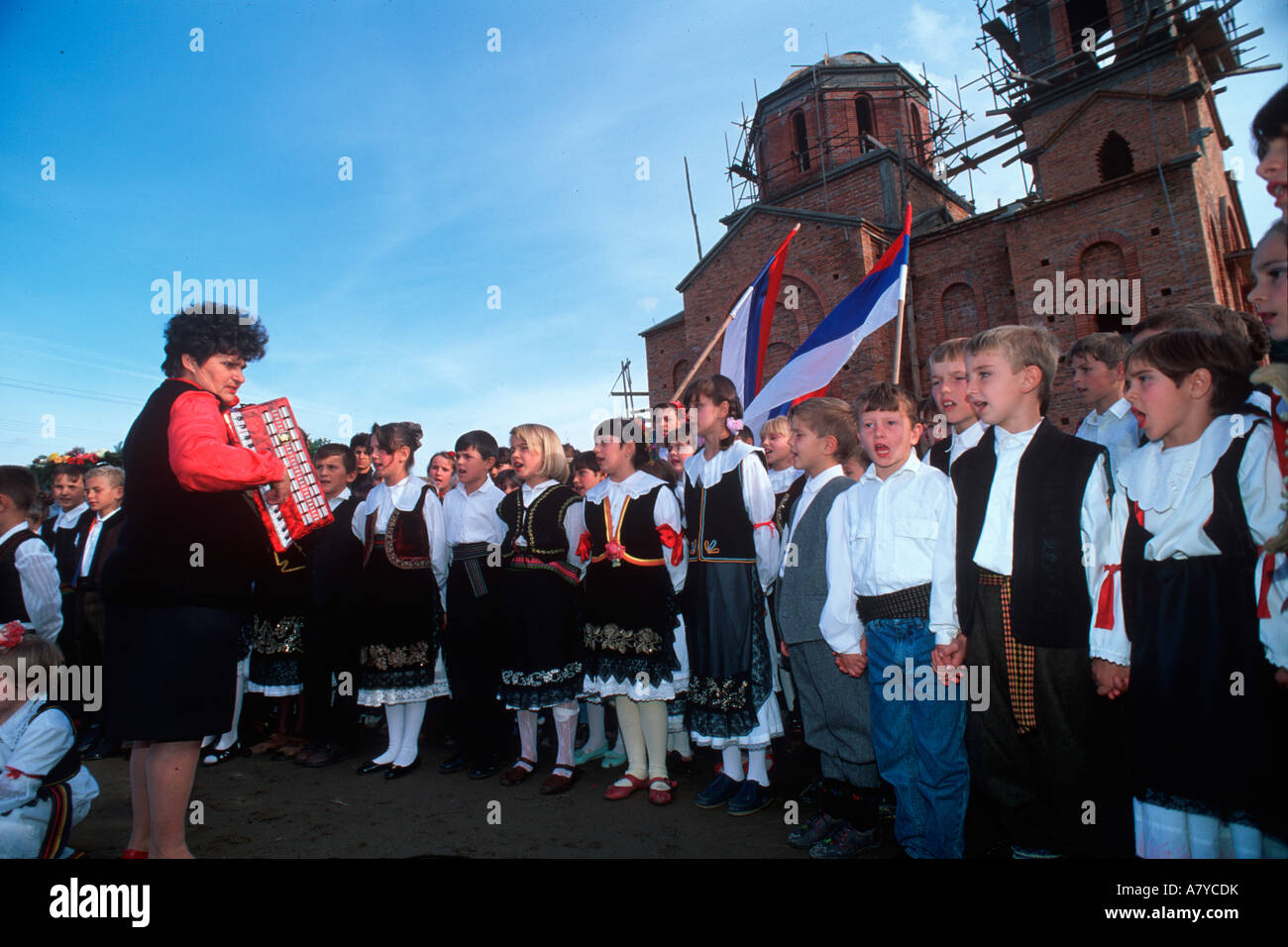 Serbian children sing for Bishop Lavrentije at the bell consecration ...