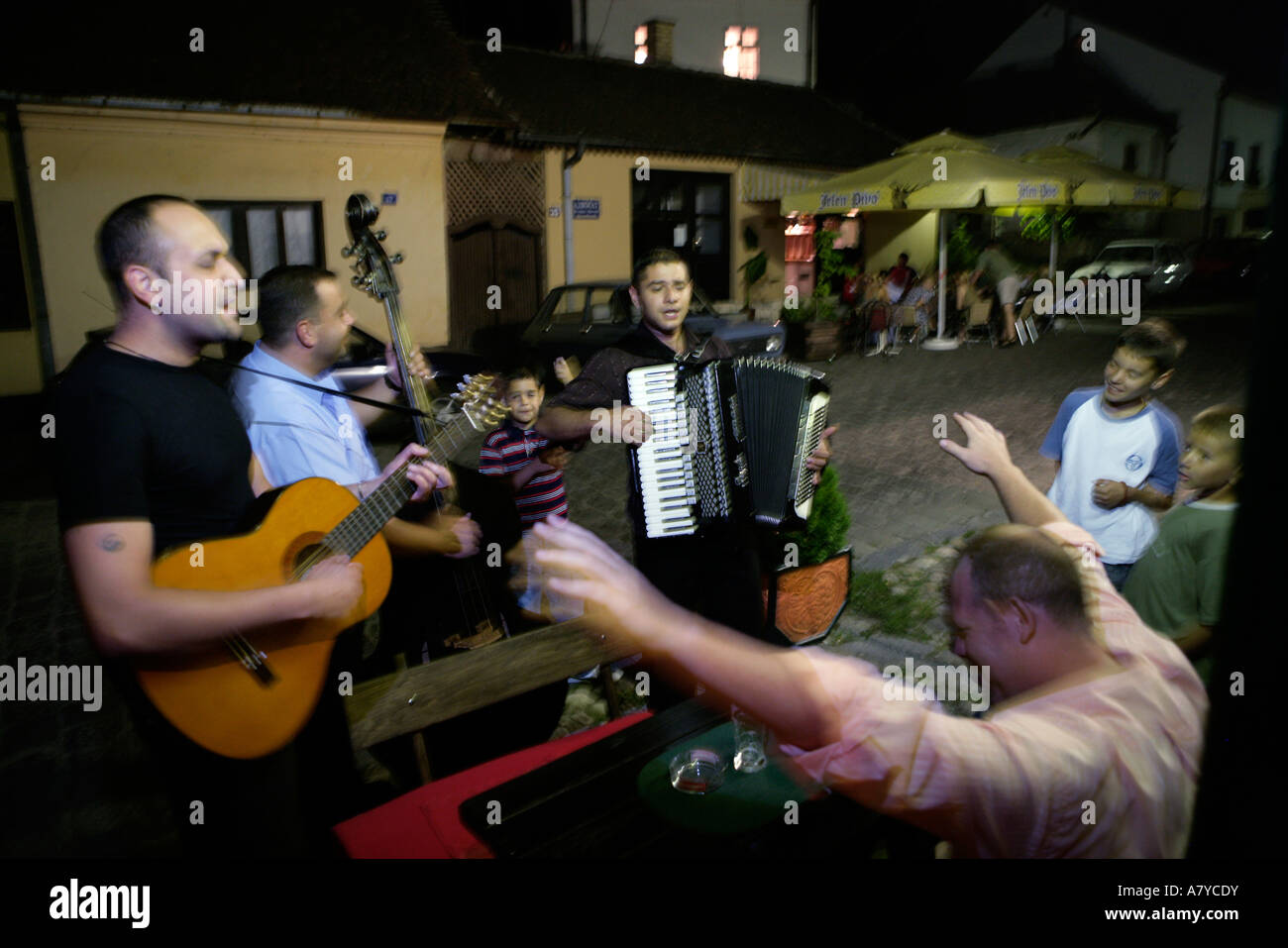 Serbian Gypsy musicians play at cafes in Valjevo, Serbia Stock Photo ...