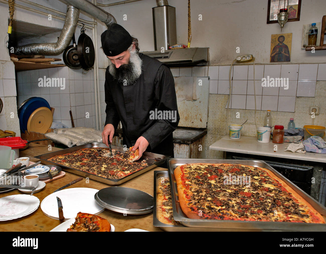 Serbian Orthodox monks and priests eat together at 14th Century Decani ...