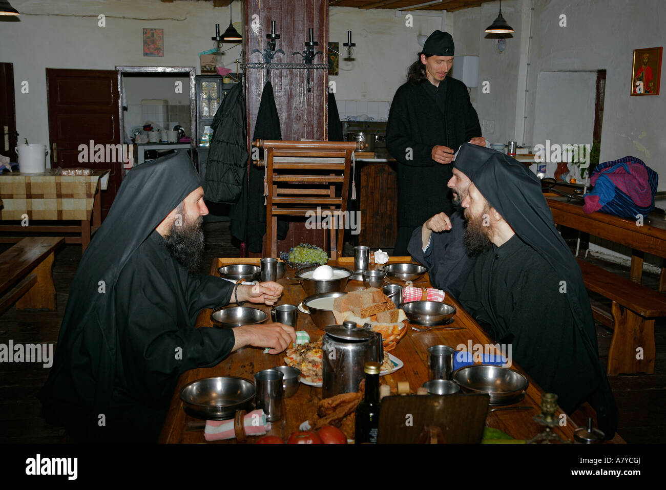 Serbian Orthodox monks and priests eat together at 14th Century Decani ...