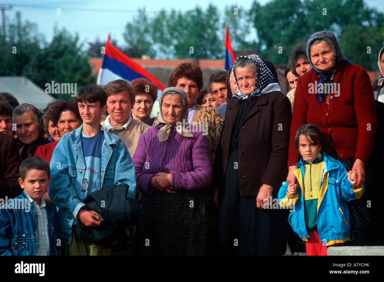Serbian village women and children watch a religious and cultural ...
