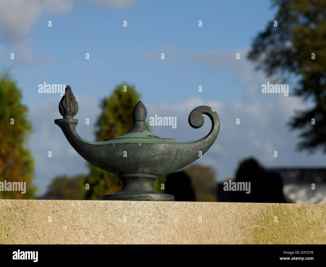 Stylished oil lamp on a gravestone as a symbol of eternal life and ...
