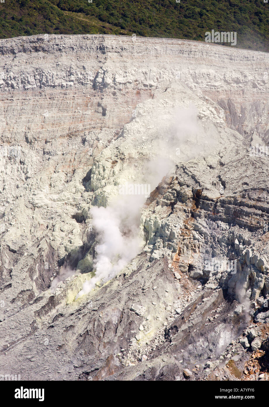 Hot steam venting from sheer vertical crater wall in the caldera of ...