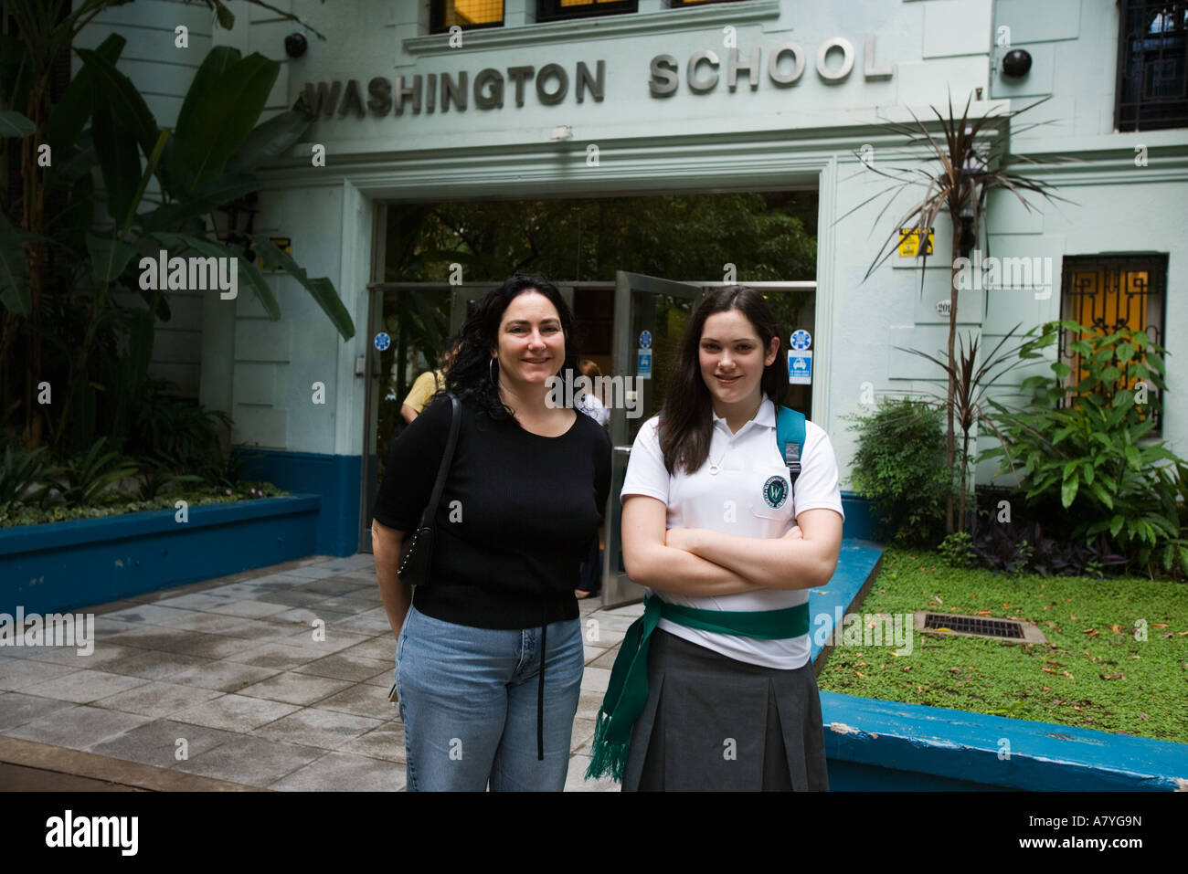 Girls in front of new school on the first day of school in Buenos Aires ...
