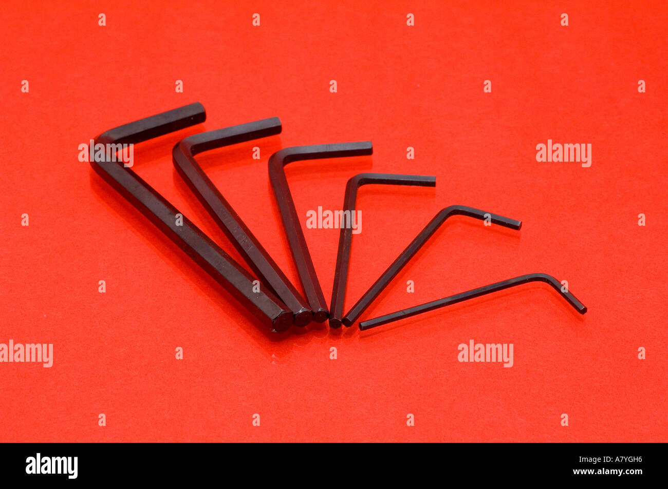 Set of small Allen keys on a red background Stock Photo - Alamy