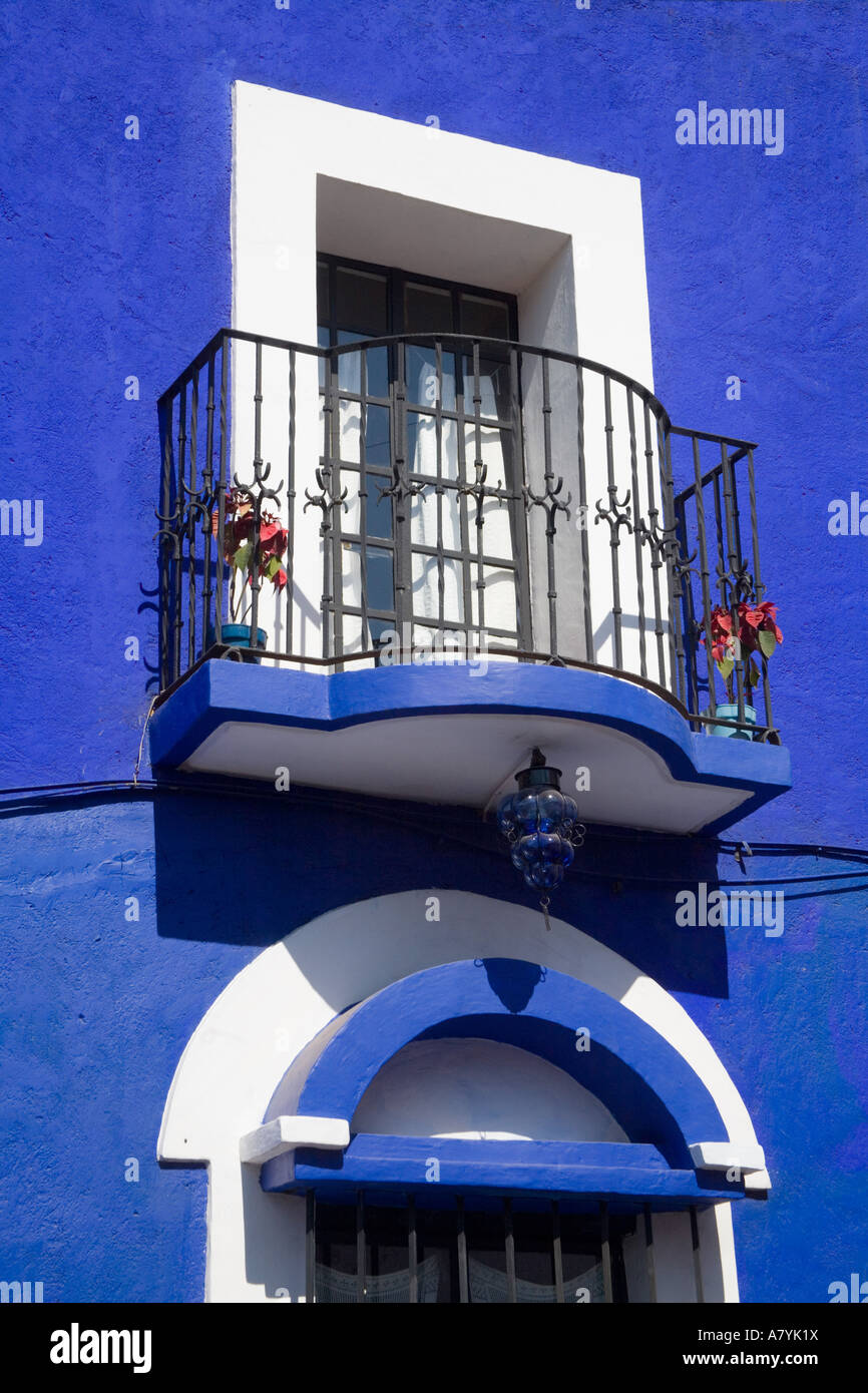 North America, Mexico, Guanajuato. Colorful building with iron balcony ...