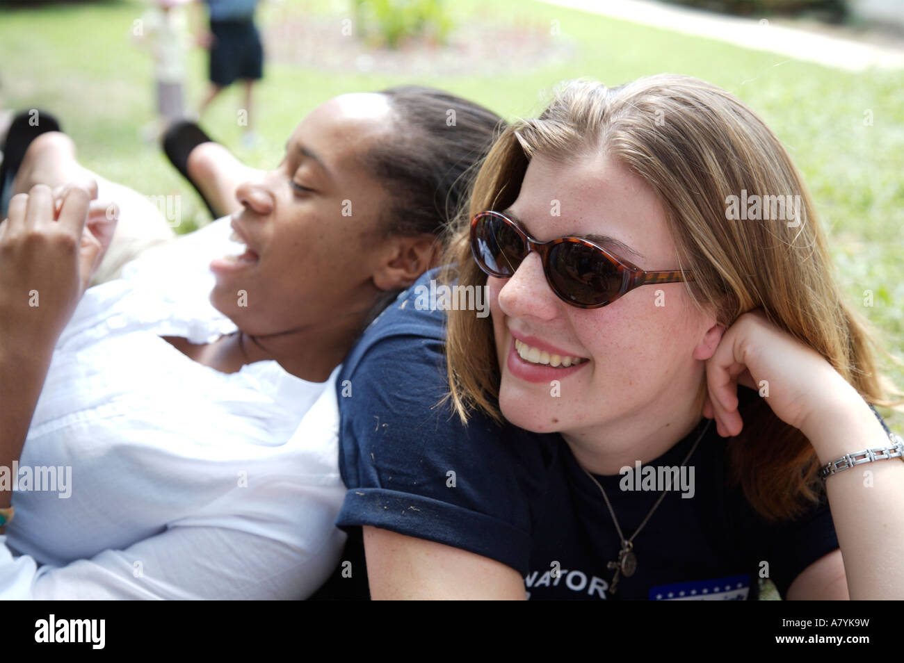 Two college age women relaxing Stock Photo - Alamy