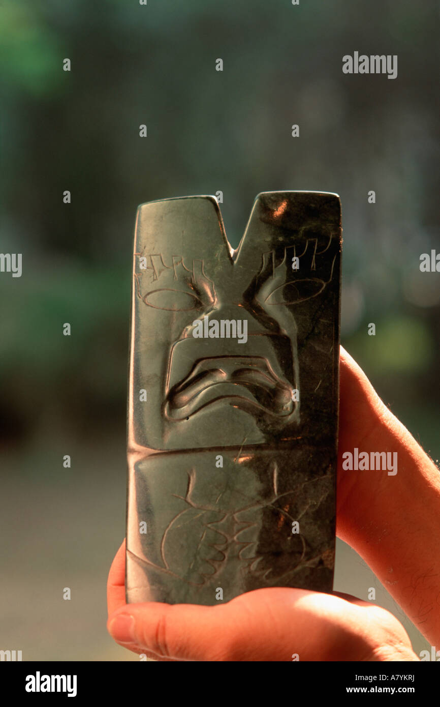 Olmec ceremonial jade ax bears cleft forehead and flame eyebrows of ...