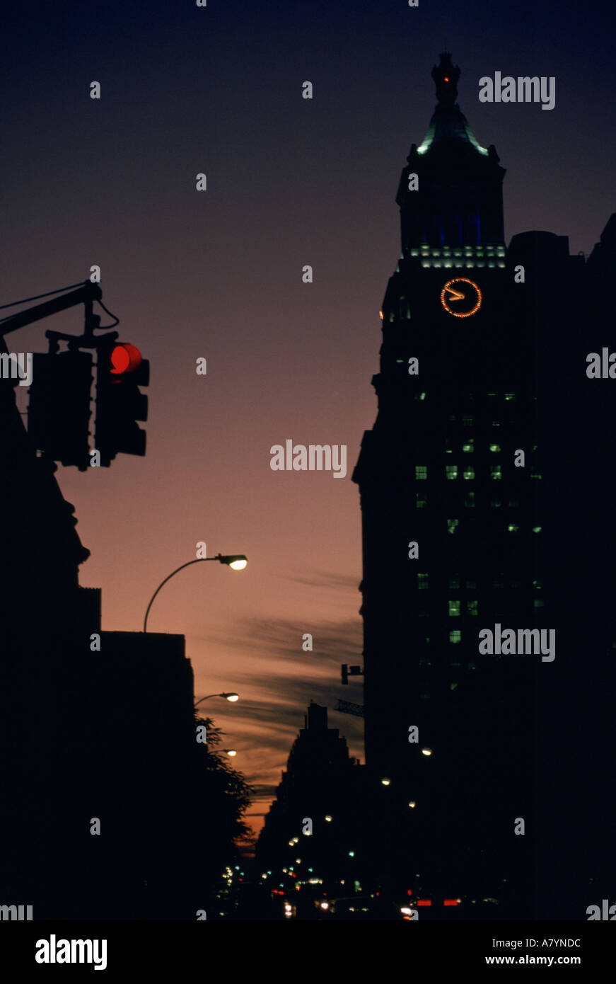 New York City mid town sunset view of clock buildings and traffic light ...