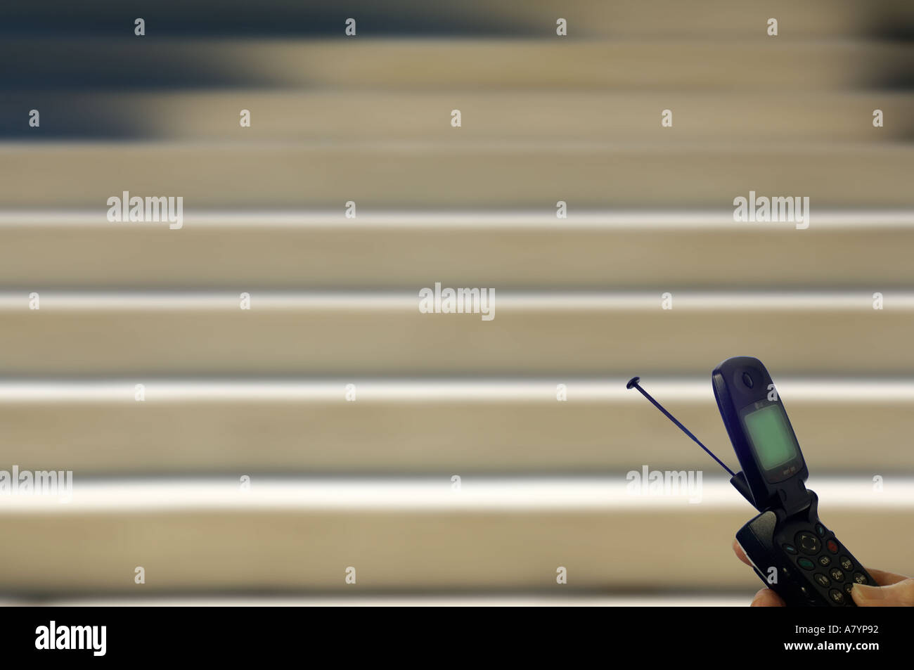 hand dialing cell phone in front of office steps in New York Stock ...