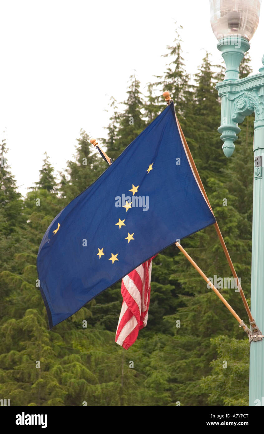 USA, Alaska, Ketchikan, downtown, flagpole with Alaskan and American ...
