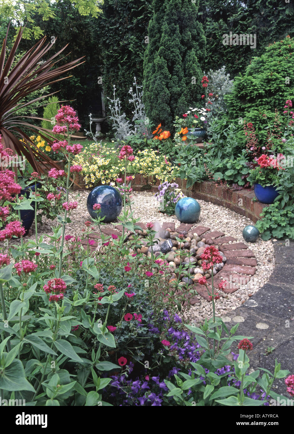 Domestic back garden mixture summer bedding perennial plants & small ...