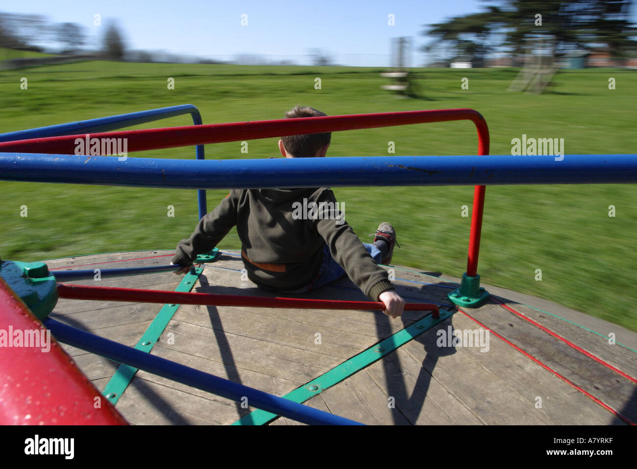 Playground roundabout hi-res stock photography and images - Alamy