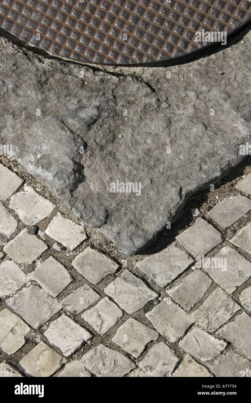 Square triangular and semi circular patterns created by drain cover ...