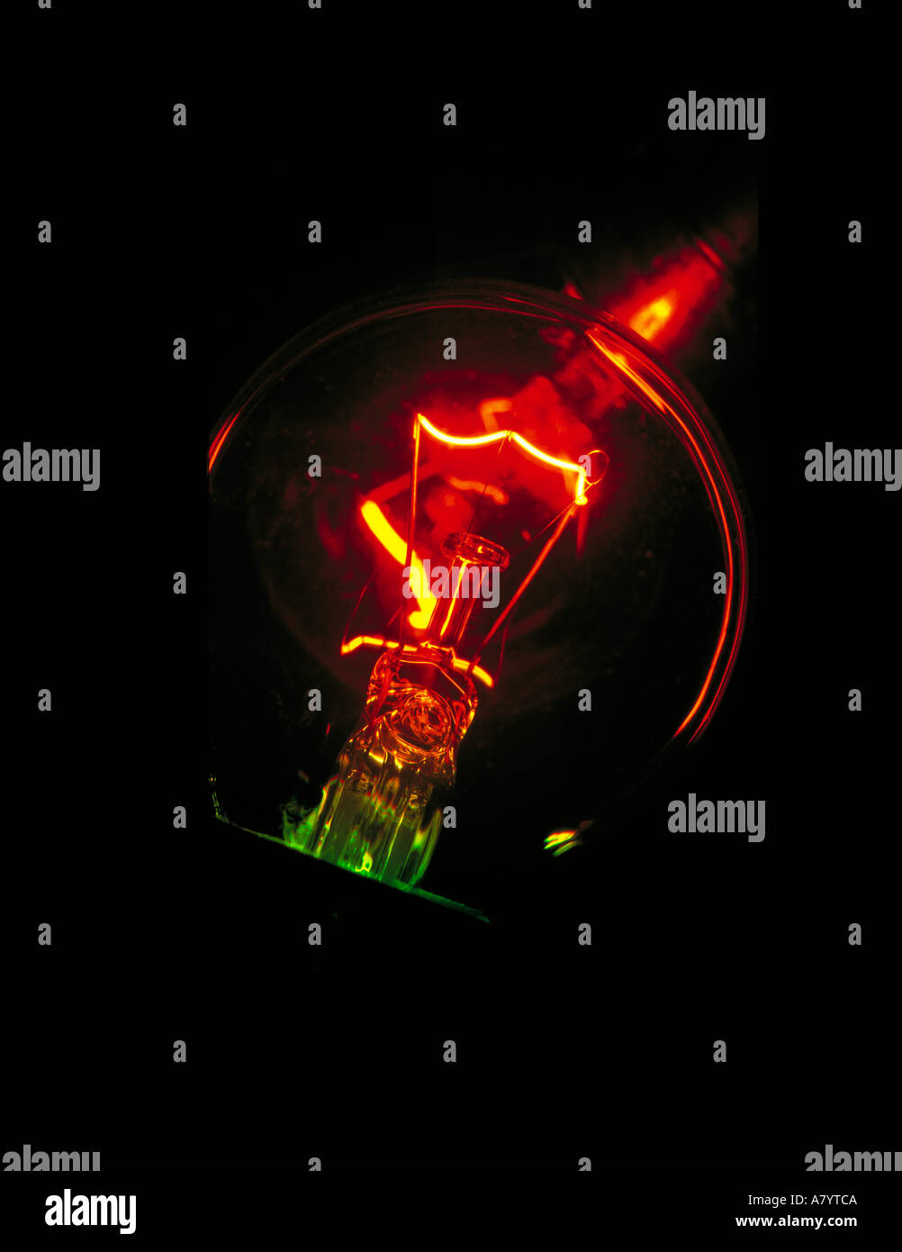 Close up details showing incandescent light bulb and filament in the ...
