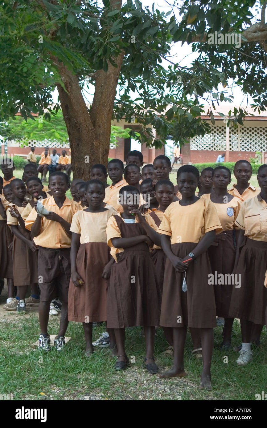 Mixed group of African pupils in local village school outside during ...
