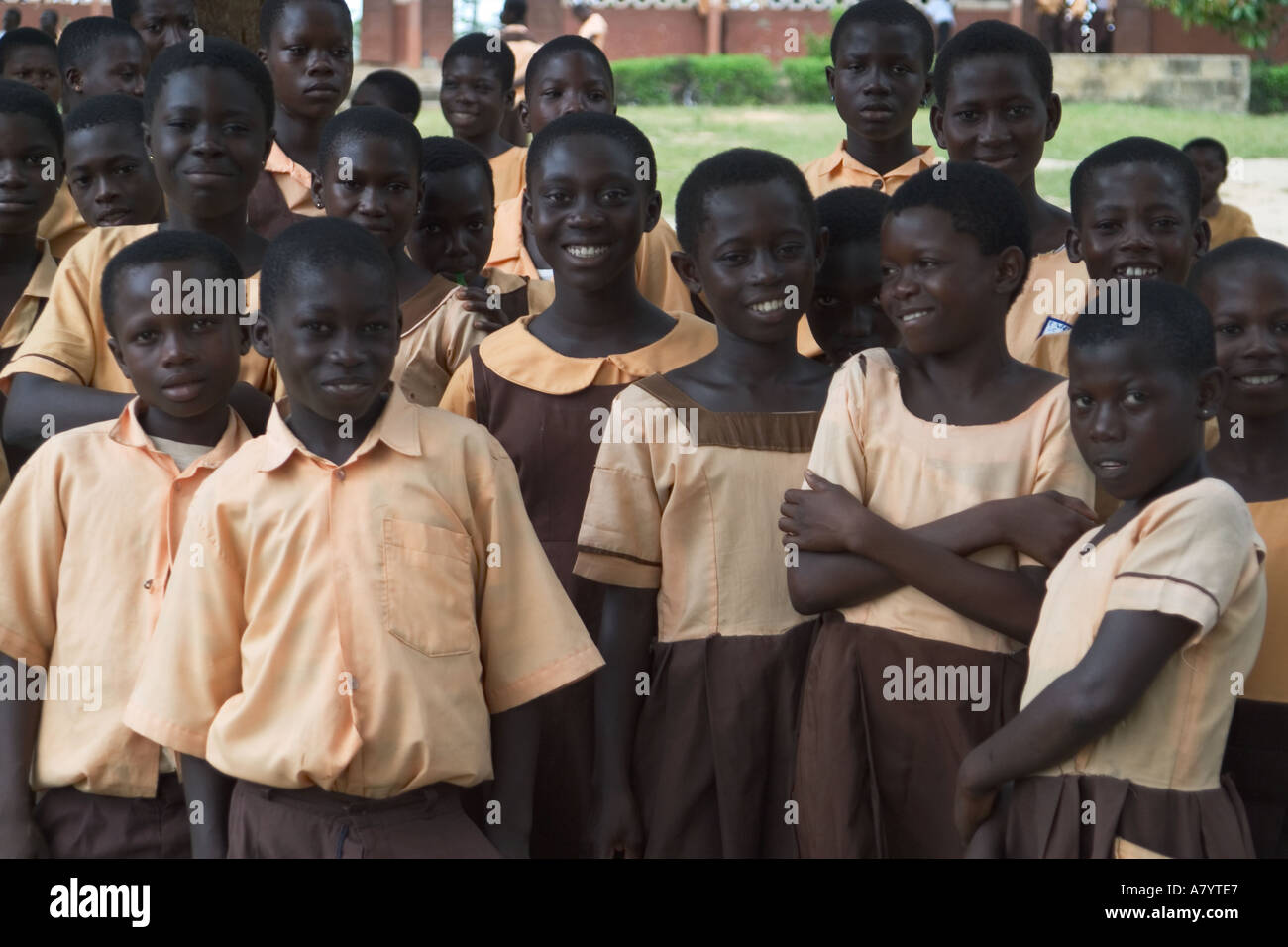 Mixed group of African pupils in local village school outside during ...
