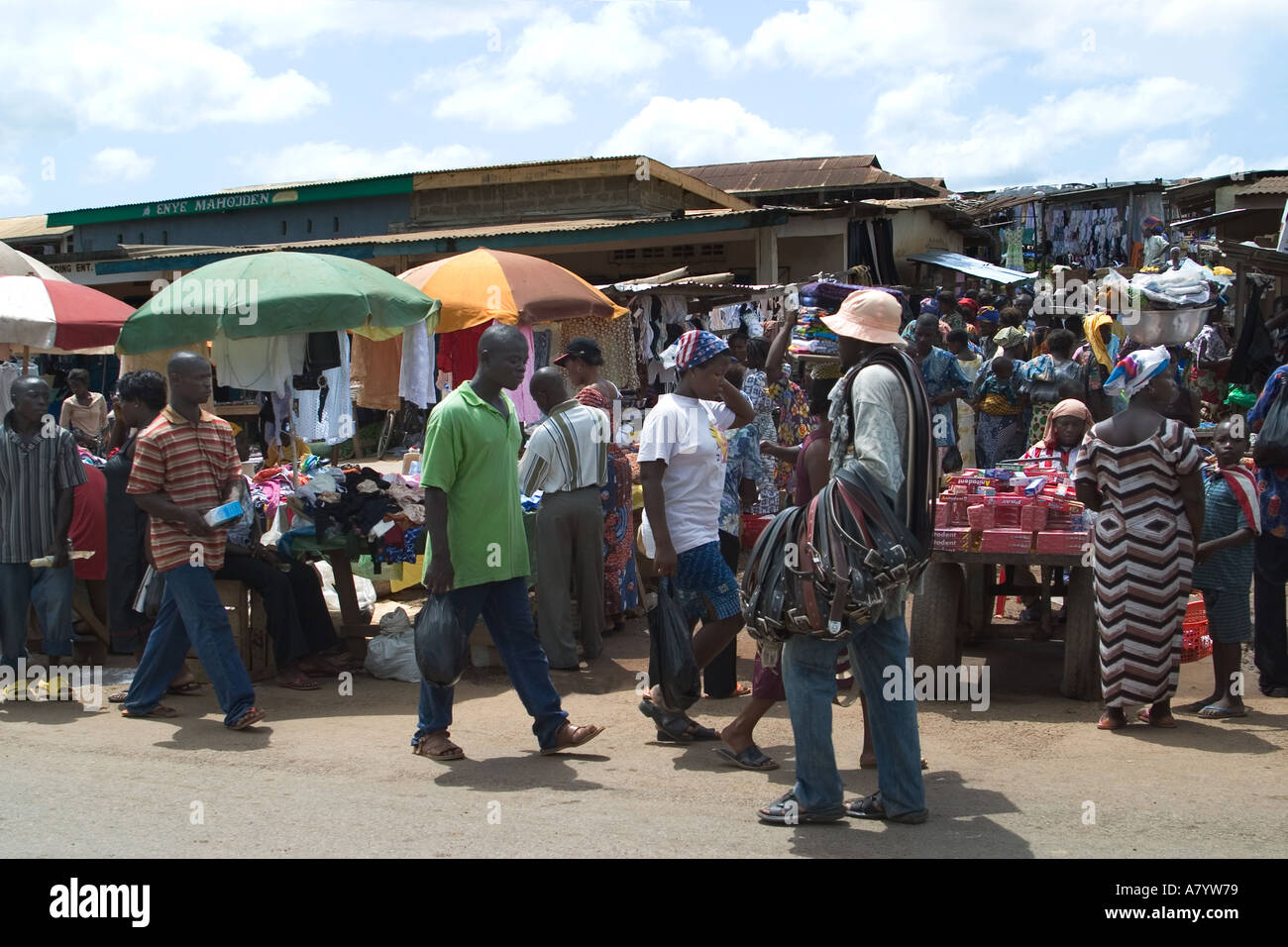 Traders, hawkers and shoppers in colourful & crowded African street ...