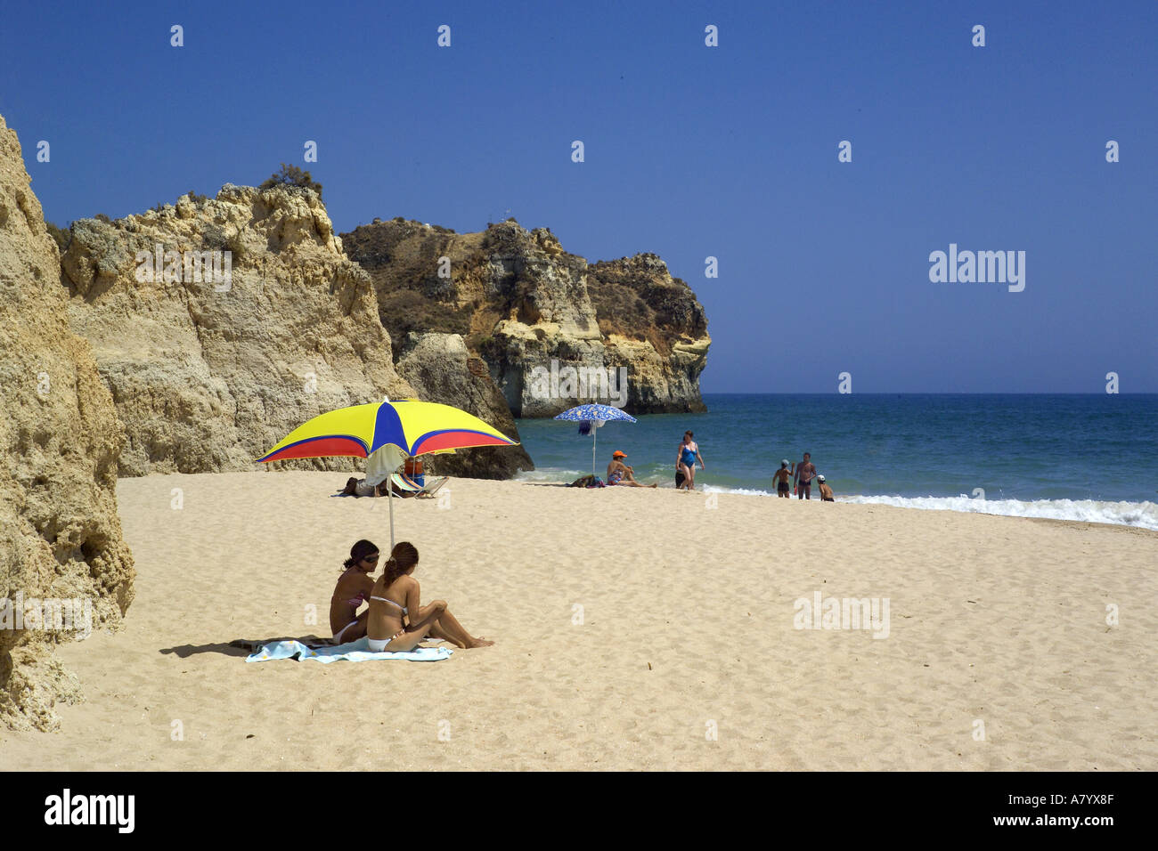 Two sunbathers umbrella hi-res stock photography and images - Alamy