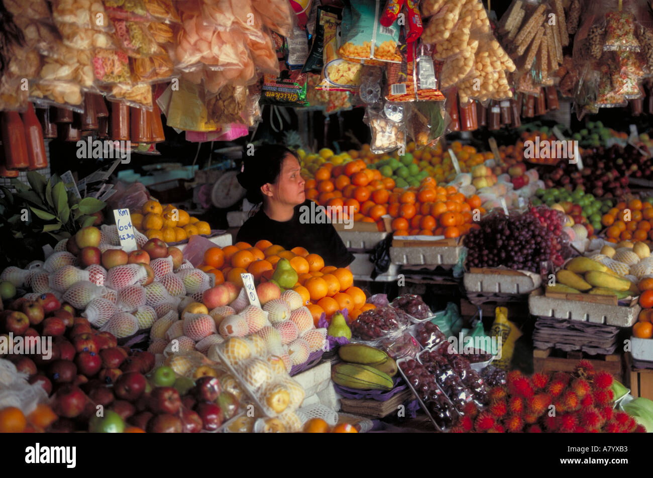 Malay fruit vegetables stall stallholder colourful bright tropical hi ...