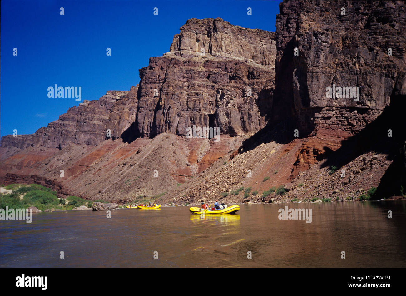 Oar powered rafts drift down the Colorado River deep inside the Grand ...